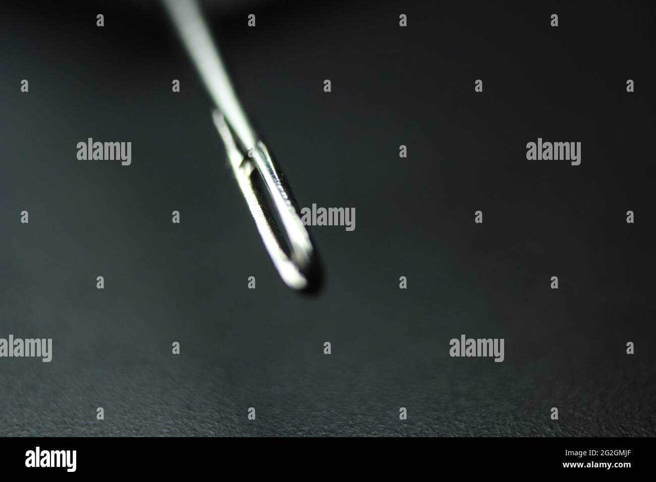 Macro shot of a sewing needle Stock Photo - Alamy