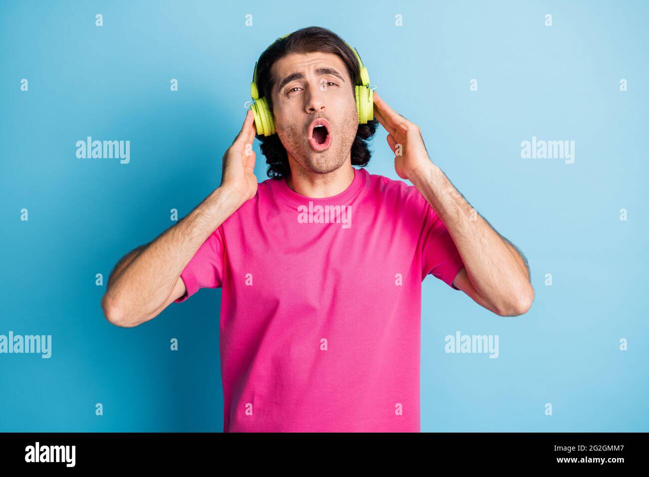 Portrait of funky guy fan enjoying listening melody single singing ...