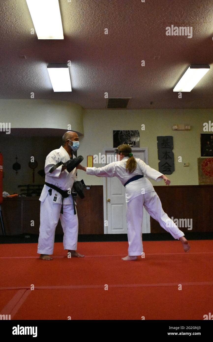 This action photo is of my daughter in her Karate class. Karate is a ...