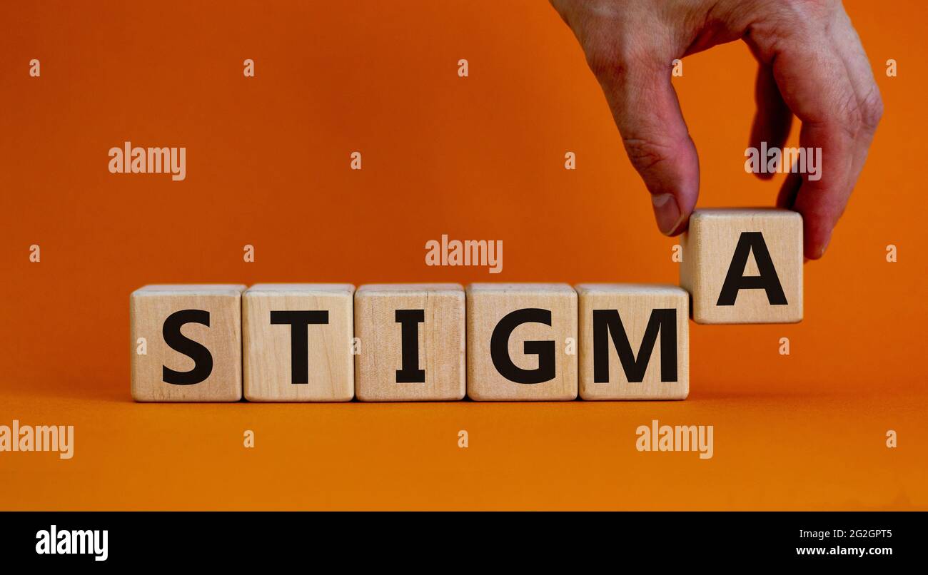 Stigma symbol. Doctor holds cubes with the word 'stigma'. Beautiful ...
