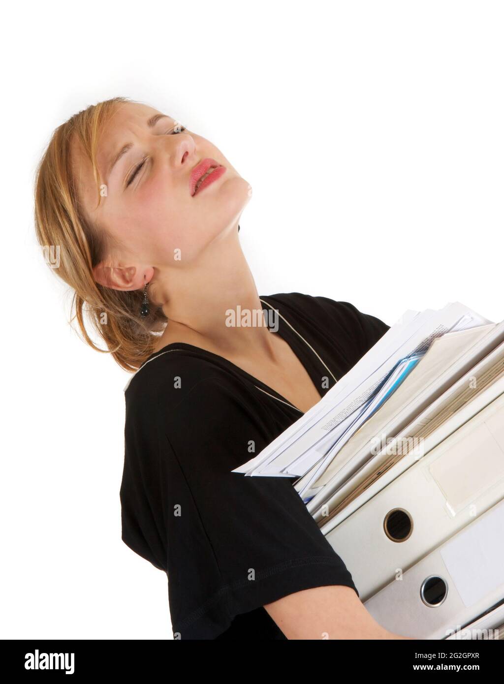 Stressed young woman carrying lots of paperwork Stock Photo - Alamy