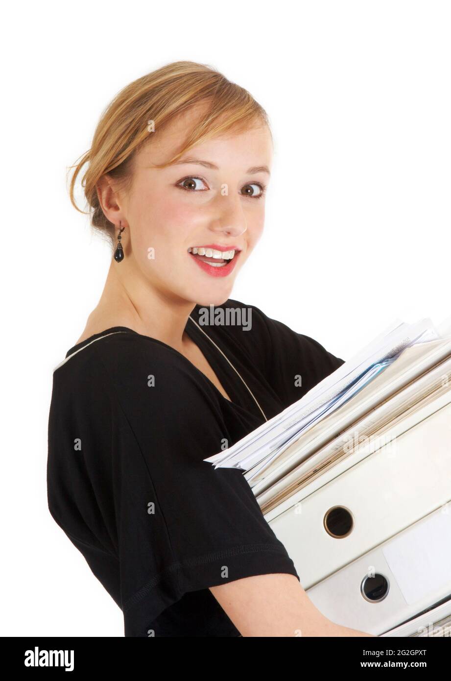Smiling young woman carrying lots of paperwork Stock Photo - Alamy