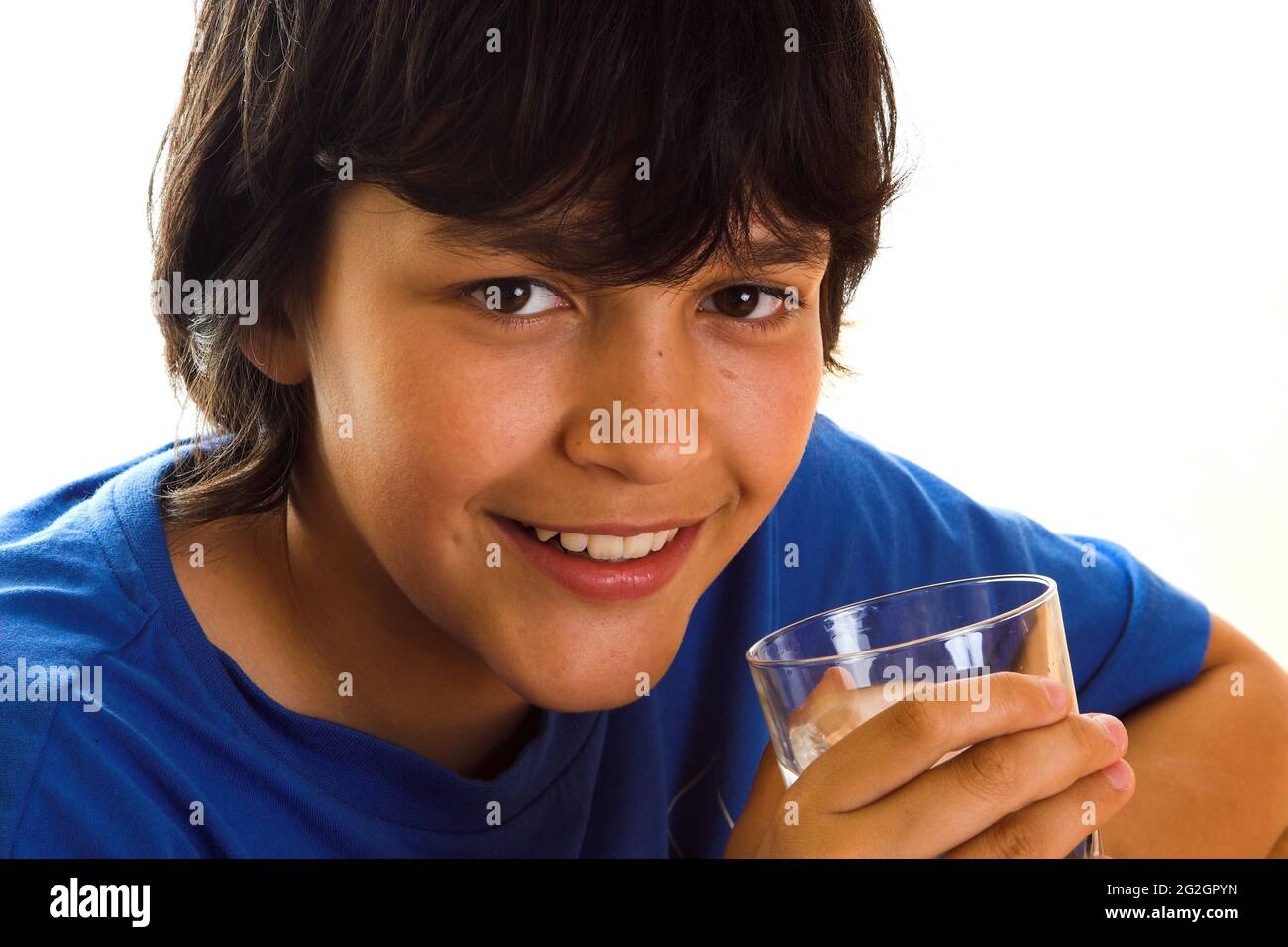 Boy drinking water with a smile Stock Photo - Alamy