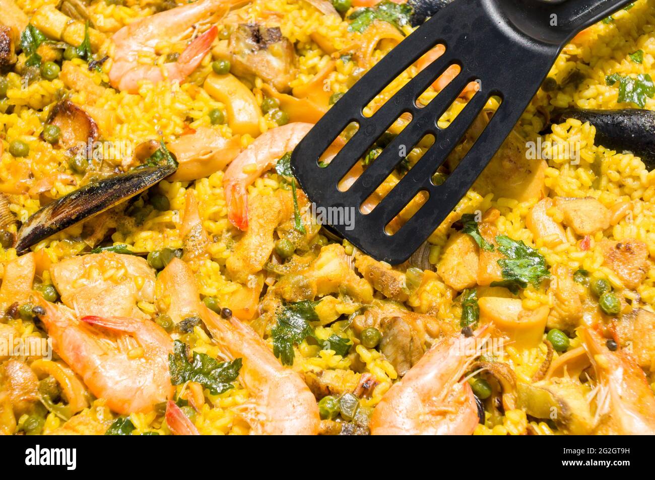 Paella cooking process, typical Spanish food Stock Photo - Alamy