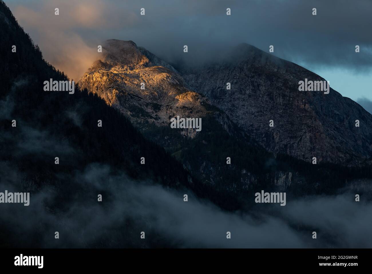A mountain flank in the Berchtesgaden NP in the first sunlight Stock ...
