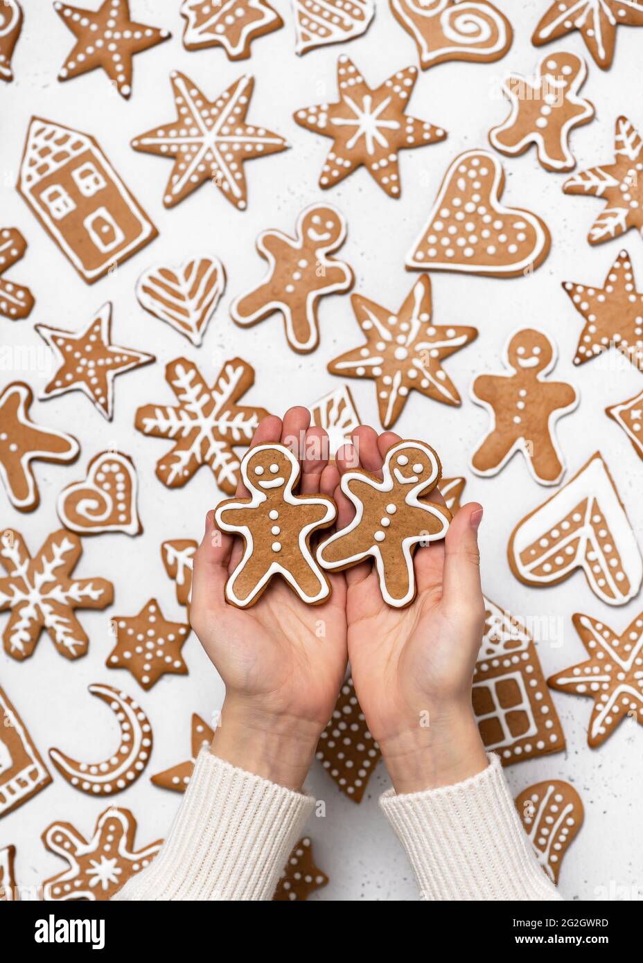 Hands holding homemade two Gingerbread man cookies. Christmas sweet ...