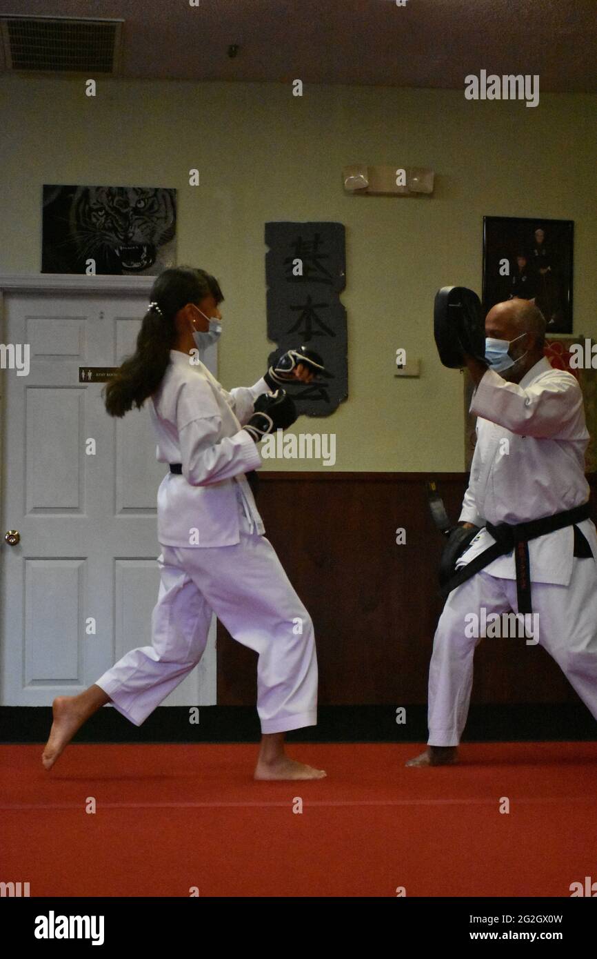 This action photo is of my daughter in her Karate class. Karate is a ...