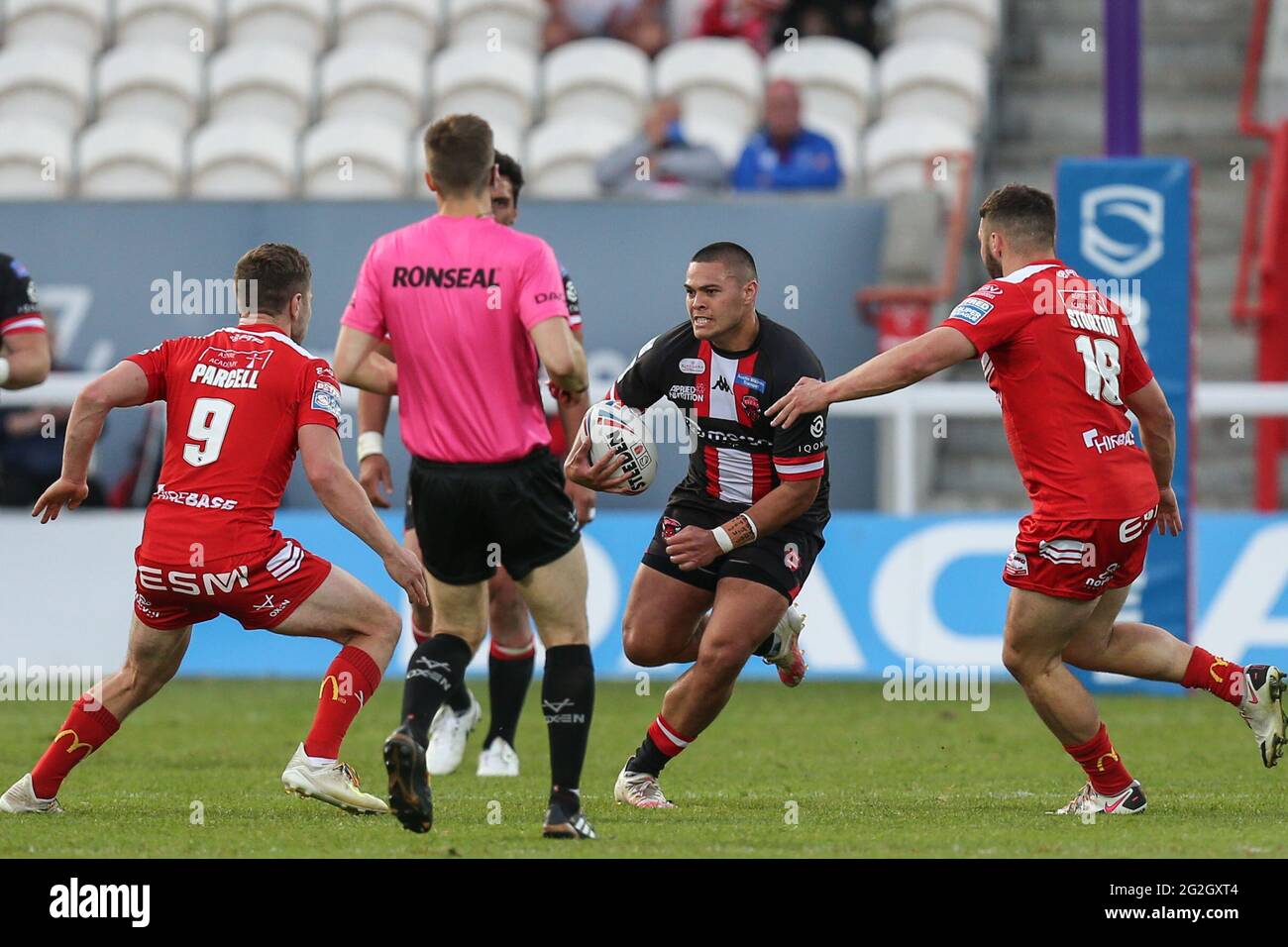 Tui Lolohea (6) of Salford Red Devils runs at the Hull KR defence Stock ...
