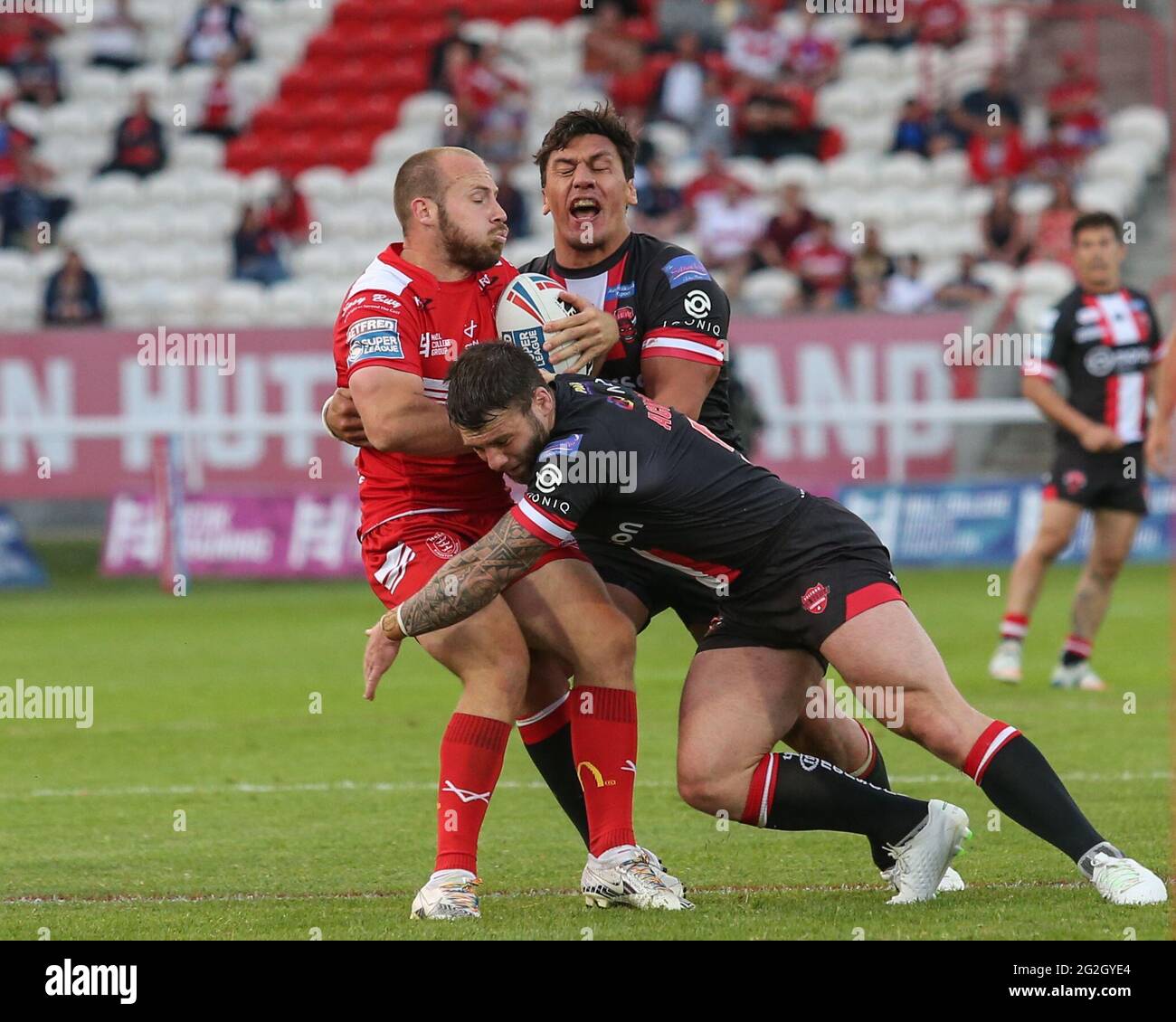 Adam Quinlan (1) of Hull KR is tackled by the Salford defence Stock ...