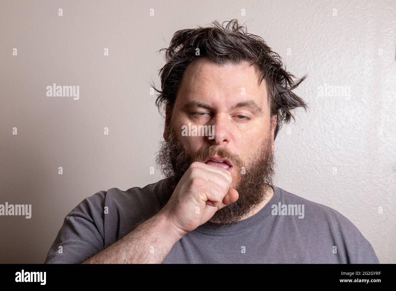 Sick man coughing Stock Photo - Alamy