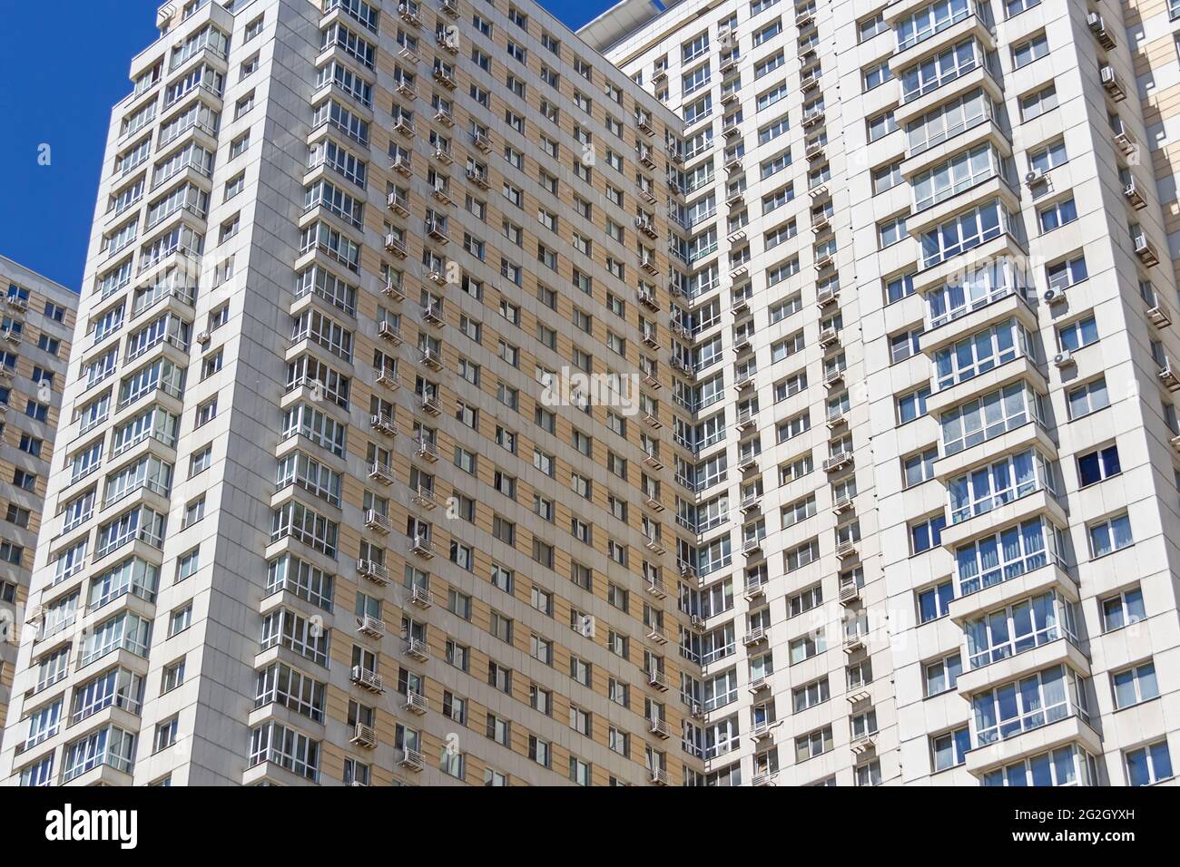 Facade of a high-rise apartment building. Typical city development ...