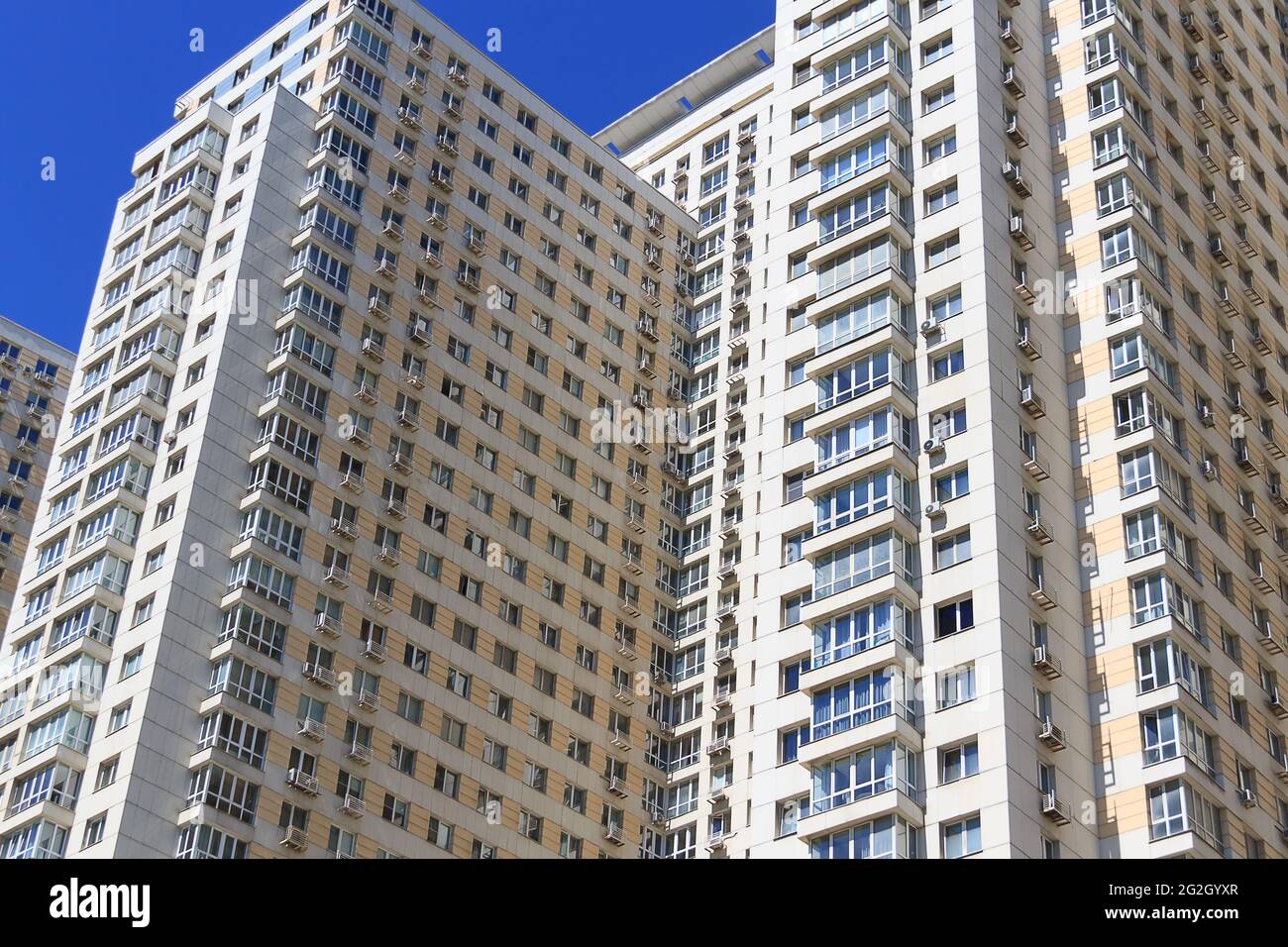 Facade of a high-rise apartment building. Typical city development ...