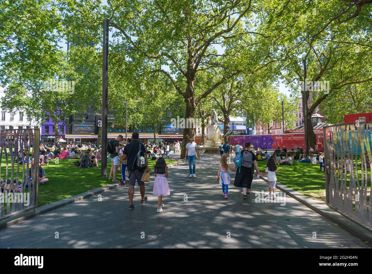 People out and about and relaxing on a warm, sunny, summer day in ...
