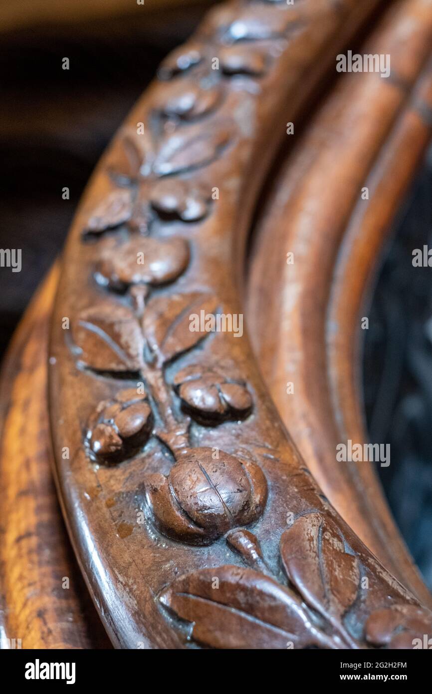 Close up photograph showing detail on the carved wooden handrail of the ...