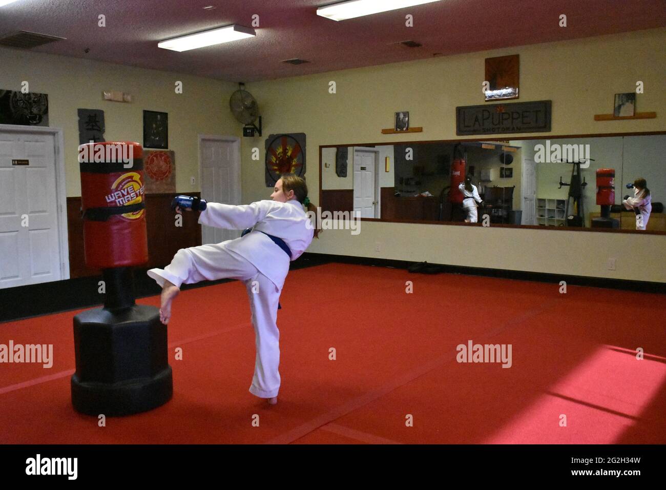 This action photo is of my daughter in her Karate class. Karate is a ...