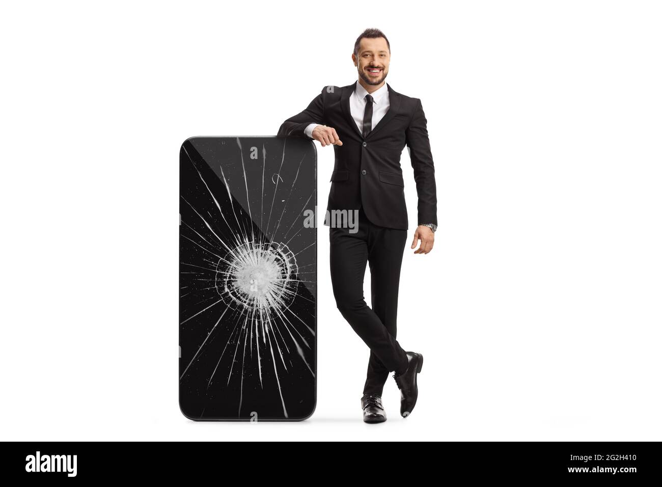 Full length portrait of a man leaning on a big smartphone with a broken ...