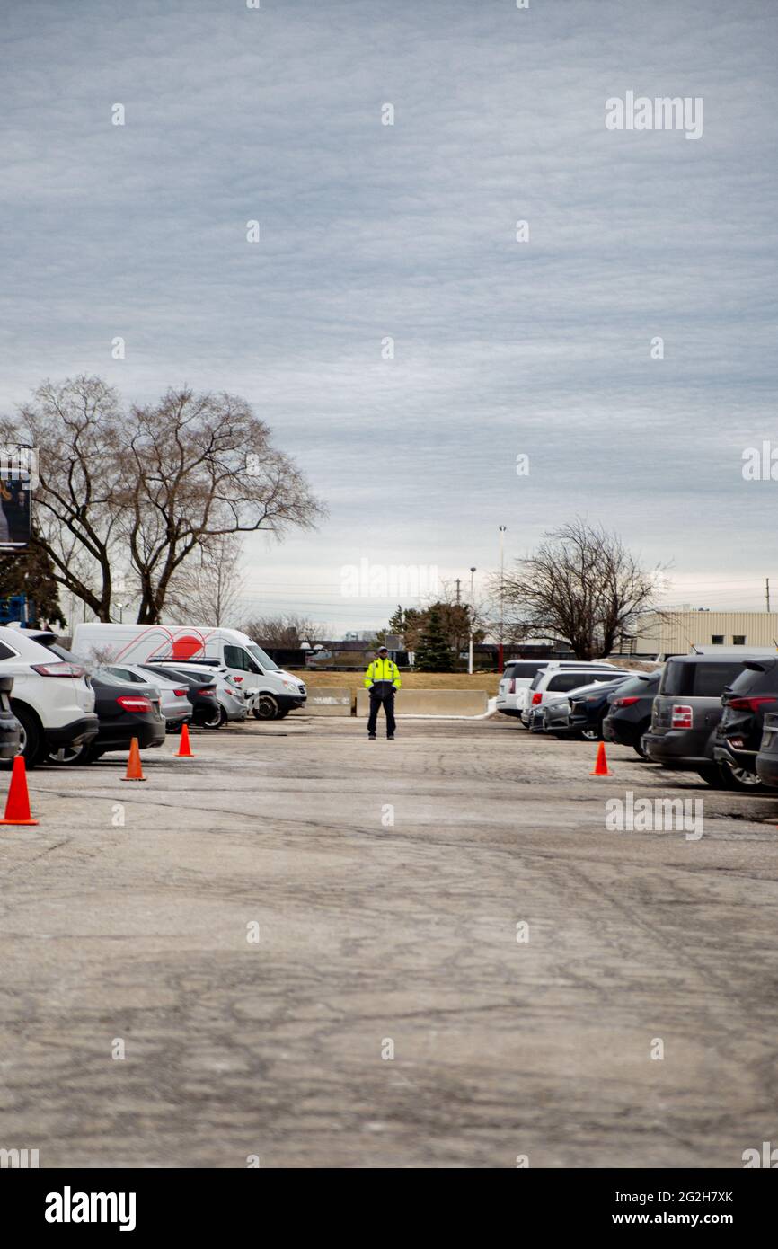 Vertical shot of a security guard watching over parking area Stock ...