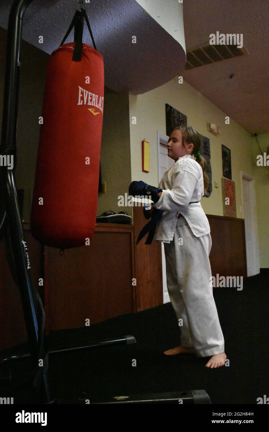 This action photo is of my daughter in her Karate class. Karate is a ...