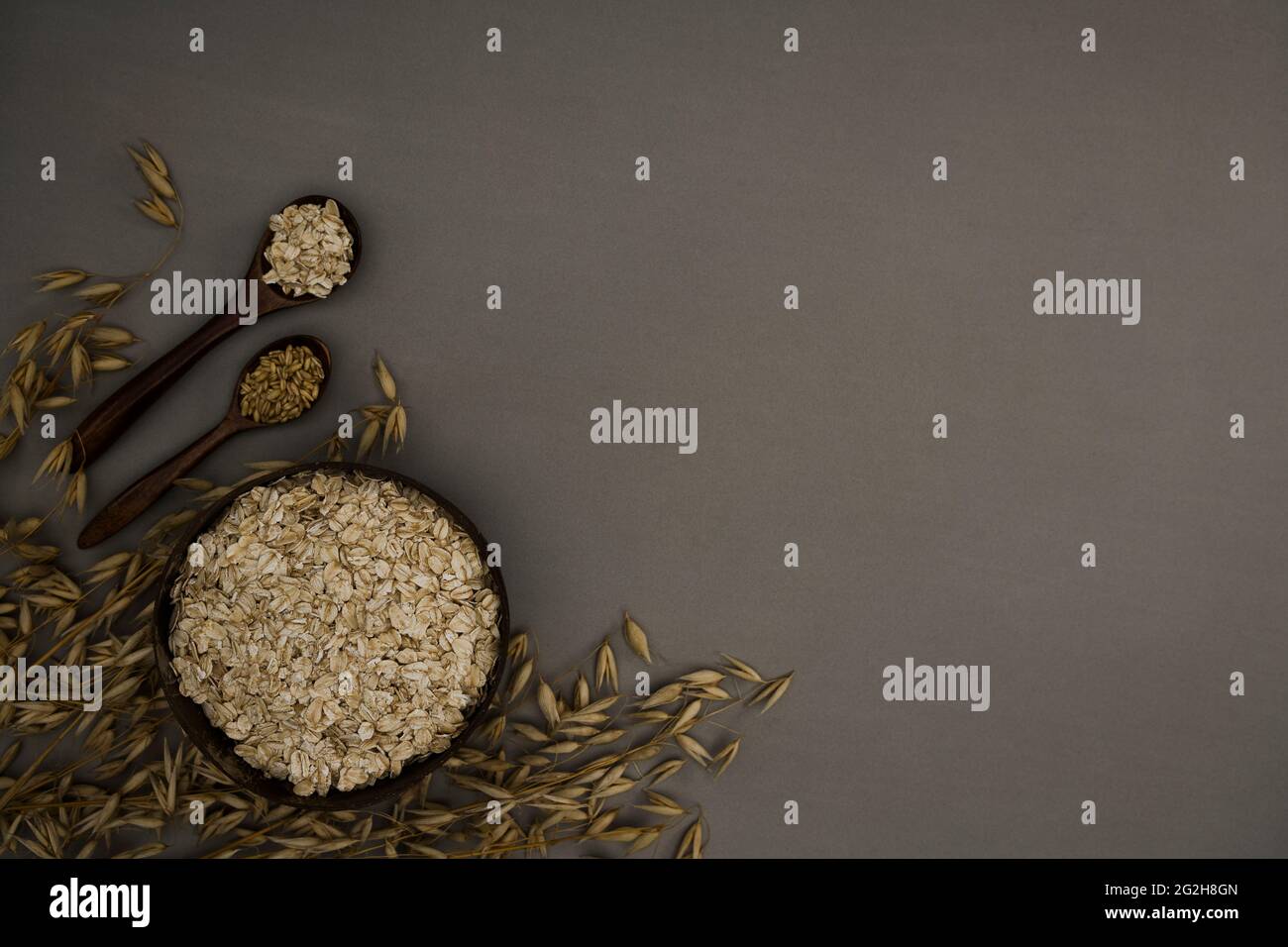 Oatmeal, ear of oatmeal, bowl, spoon, top view Stock Photo - Alamy