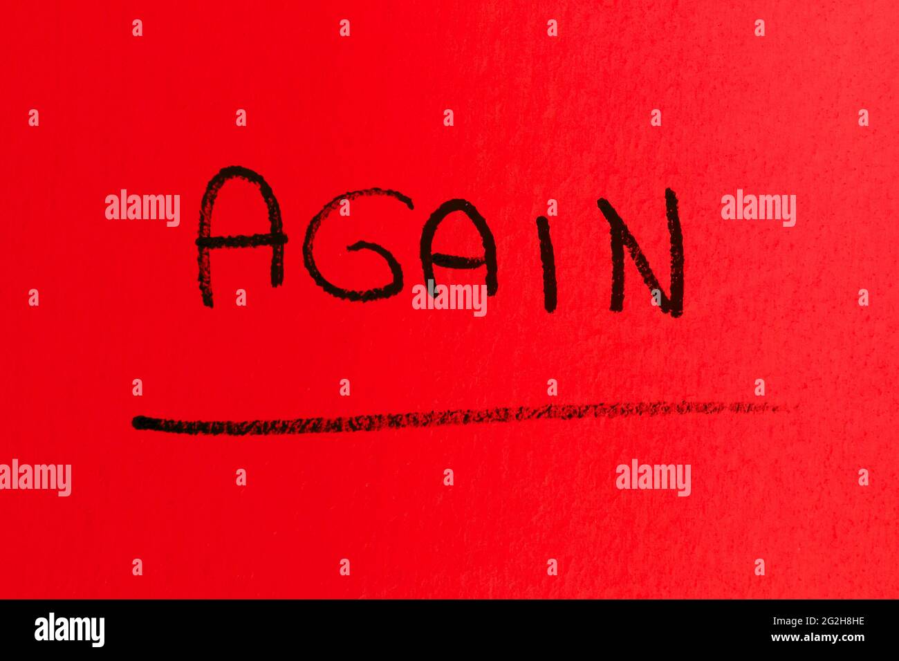AGAIN word made with spray paint on red background Stock Photo - Alamy
