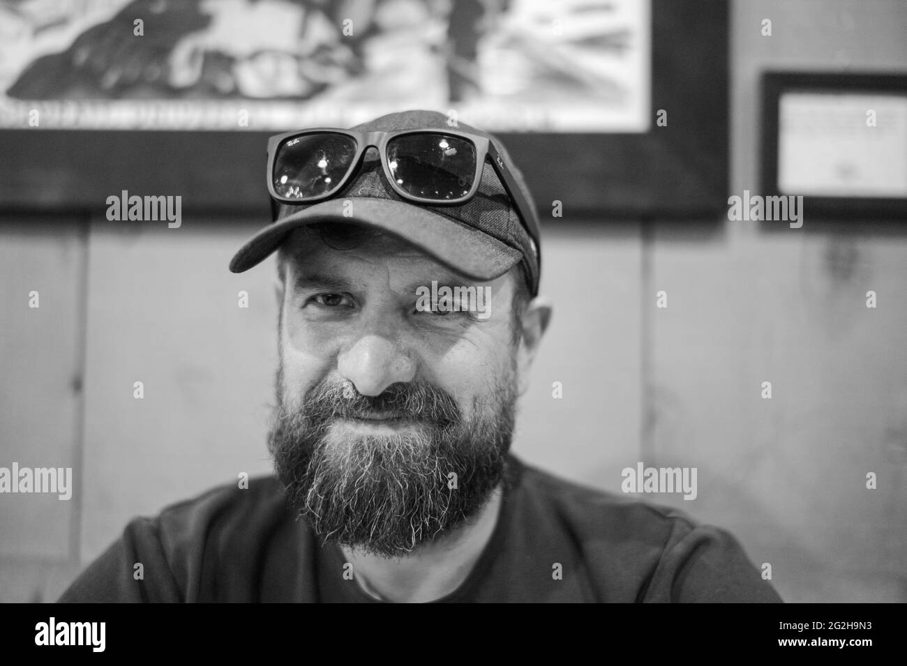 Man with cap and sunglasses resting in Death Valley National Park ...