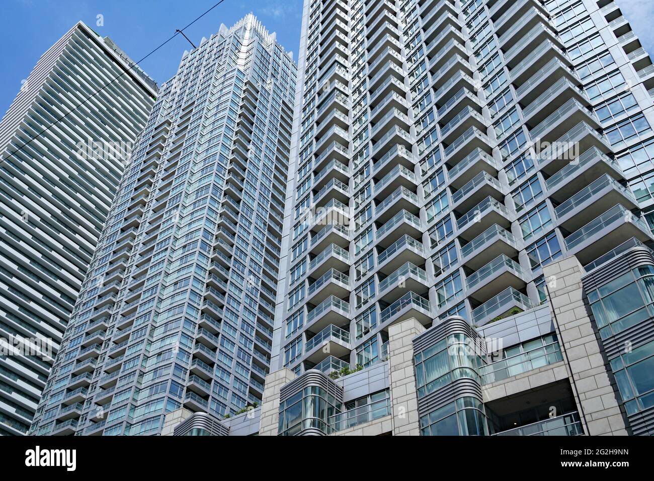 Row of modern urban high rise apartment buildings with balconies Stock ...