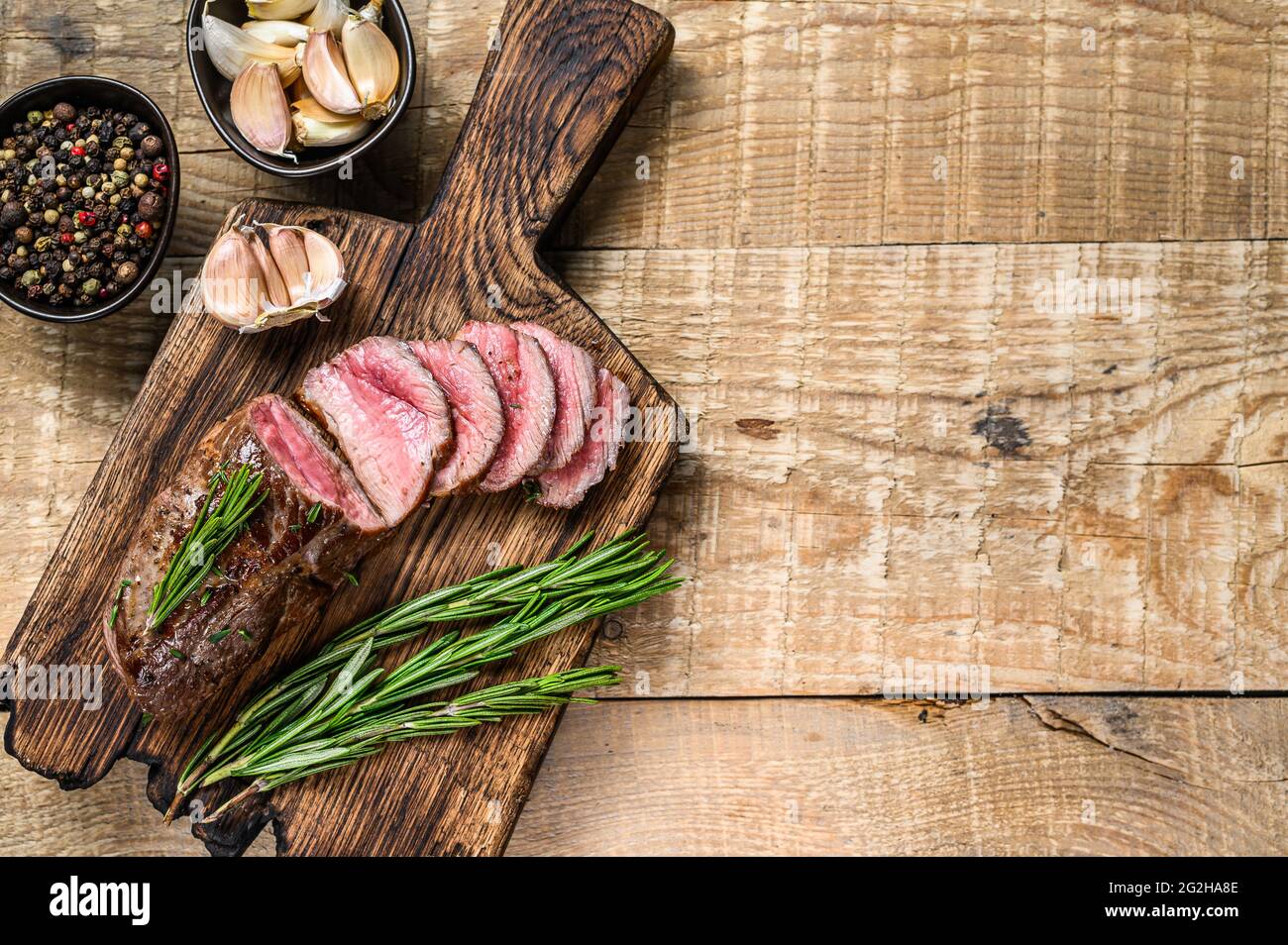 Barbecue Sliced veal tenderloin meat steak. wooden background. Top view ...