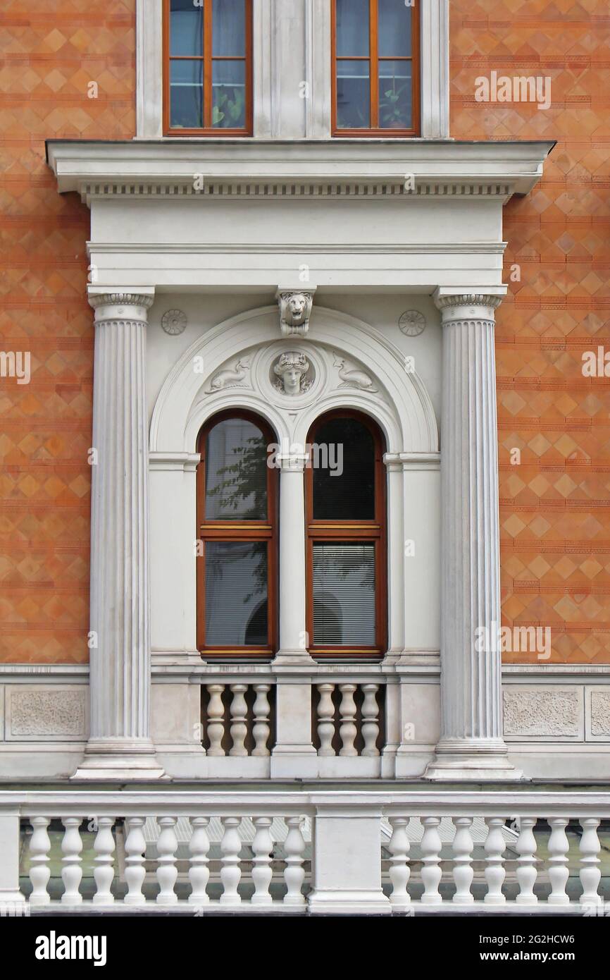 Ancient window on old building facade exterior with balcony columns ...