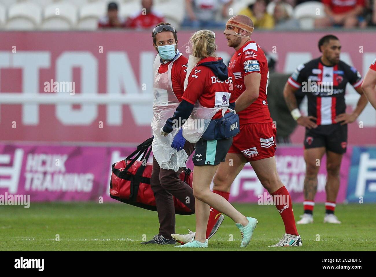 Dean Hadley (13) of Hull KR goes of for a head injury assessment in, on ...