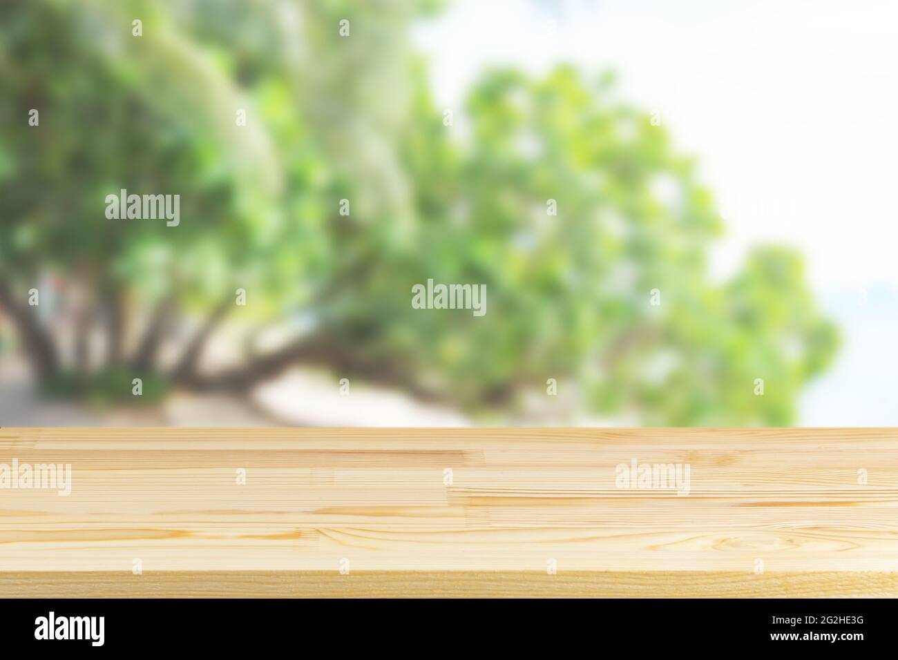 wood table top on blurred green wood background Stock Photo - Alamy