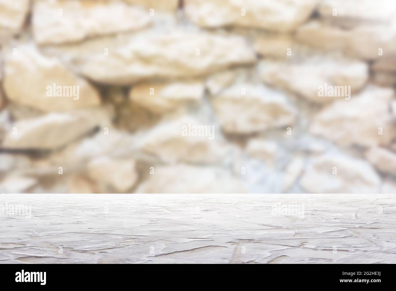 white textured surface on blur stone wall background Stock Photo - Alamy