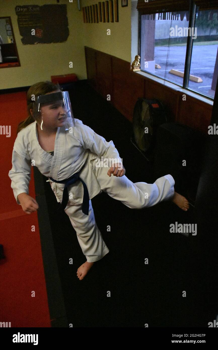 This action photo is of my daughter in her Karate class. Karate is a ...
