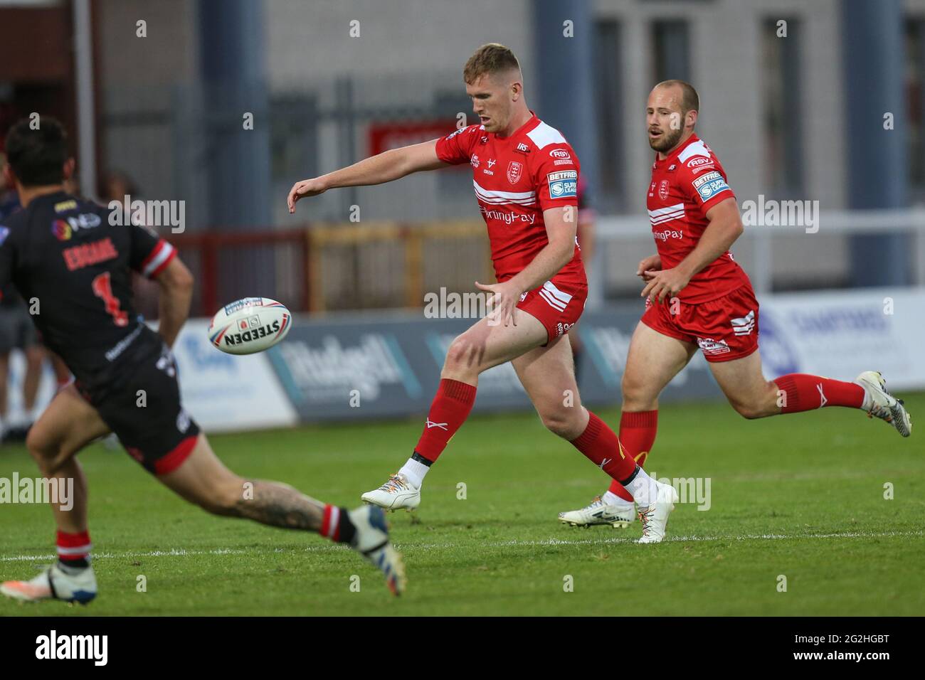 Rowan Milnes (25) of Hull KR puts a kick through Stock Photo - Alamy