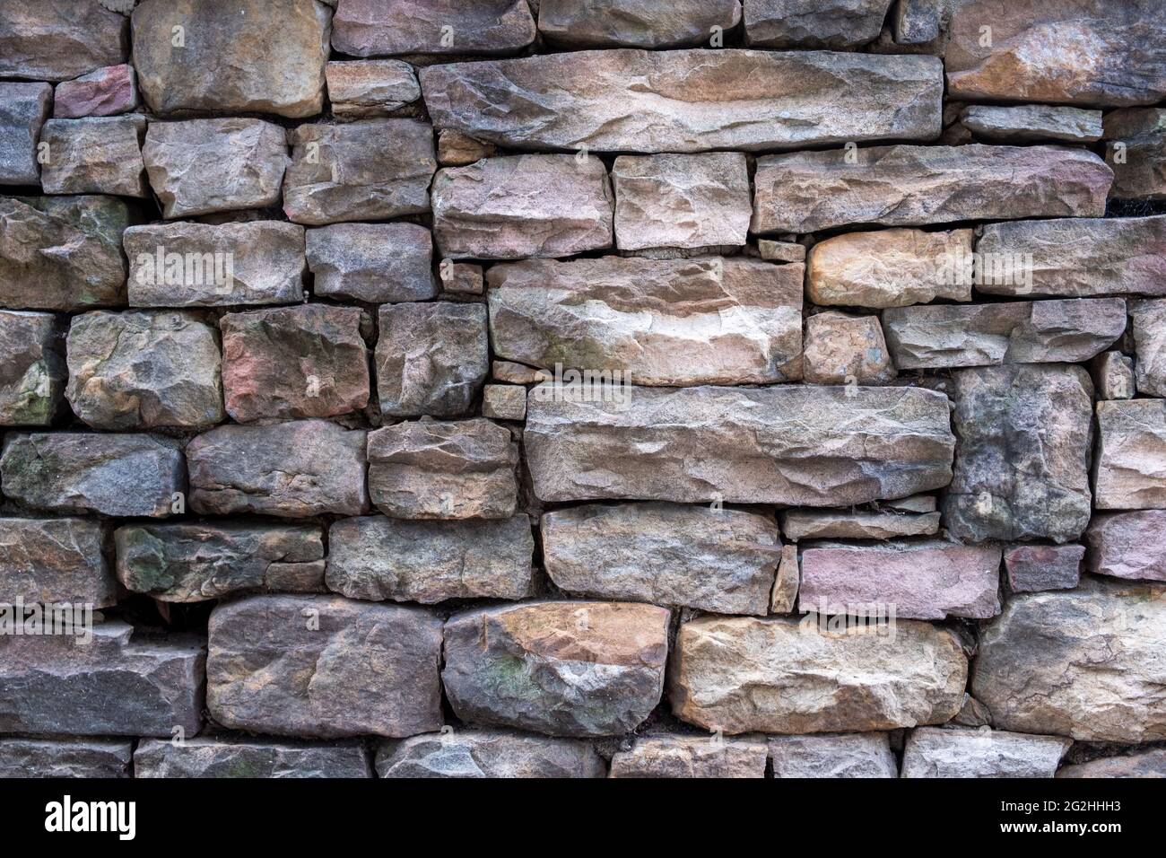 Stacked stone wall close-up for background texture Stock Photo - Alamy
