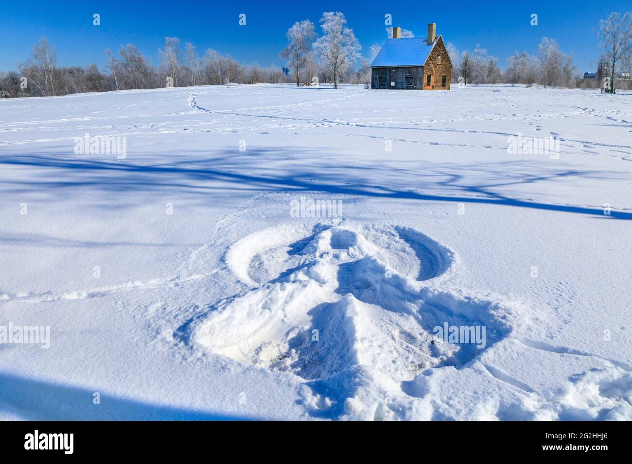 Winter idyll with a snow angel Stock Photo - Alamy