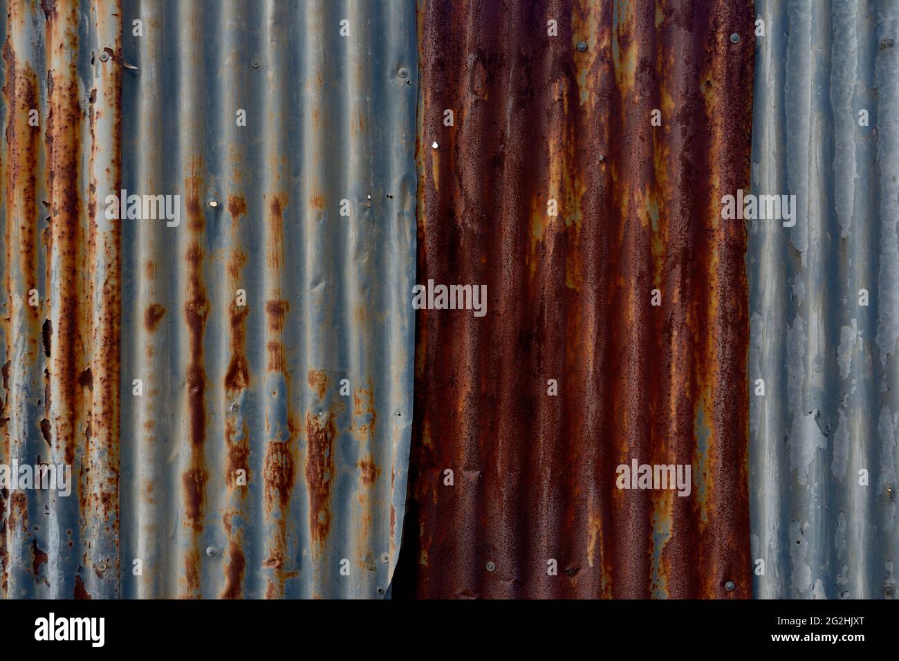 A rusty corrugated iron fence, background texture Stock Photo - Alamy