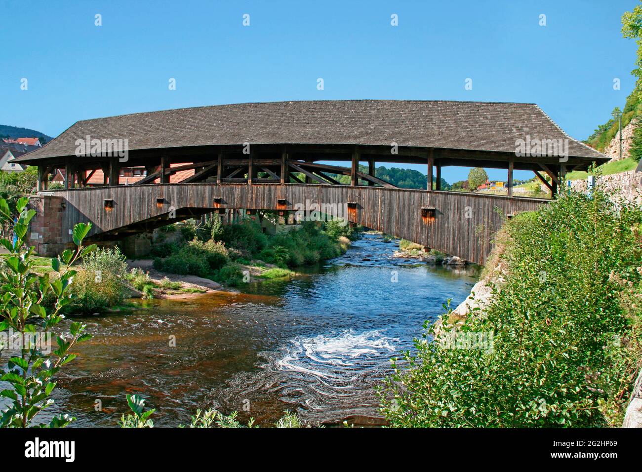 historic covered wooden bridge, Murg River, Forbach, Baden-Württemberg ...