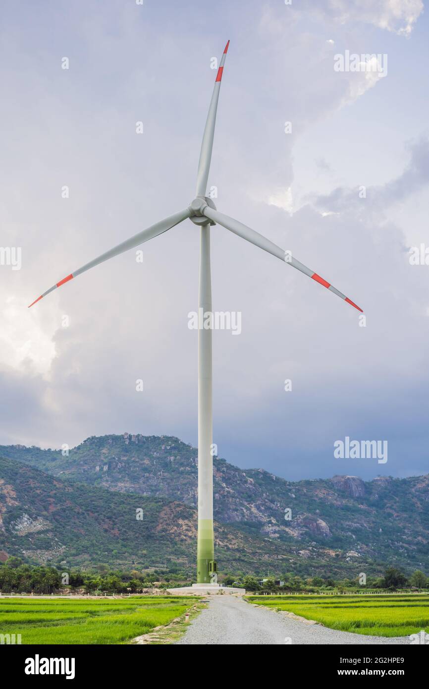 Wind power plant. green meadow with Wind turbines generating ...