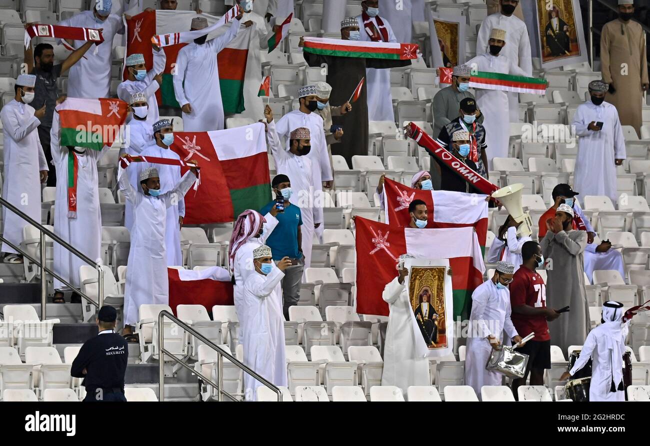 Doha, Qatar. 11th June, 2021. Fans of Oman cheer for the team during ...