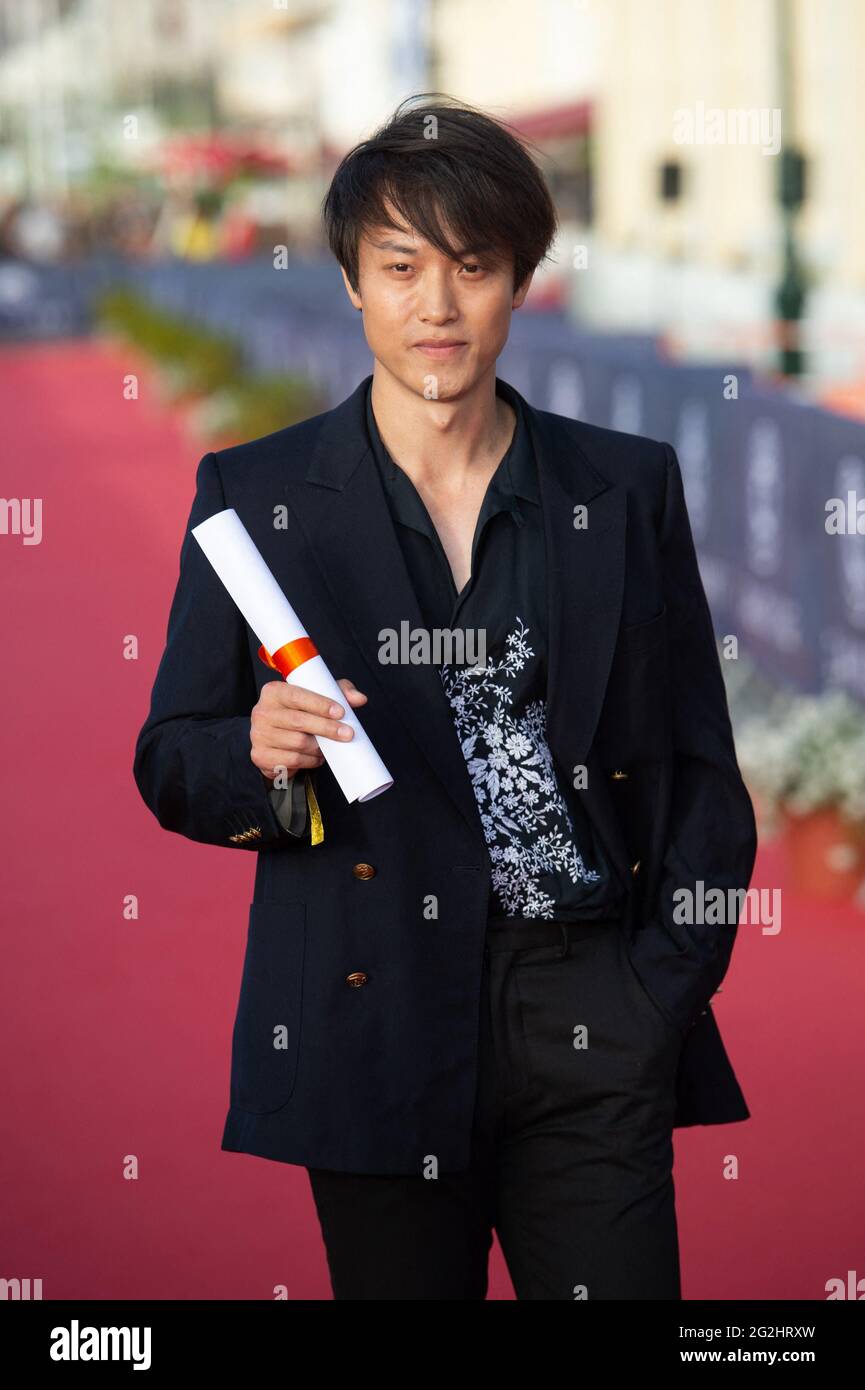 Guang Huo posing with his Premier Rendez-Vous award during the winners ...
