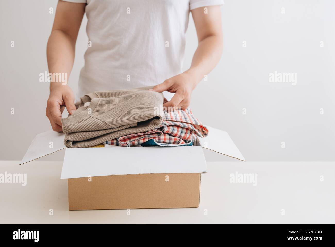 Box full of clothes hi-res stock photography and images - Alamy