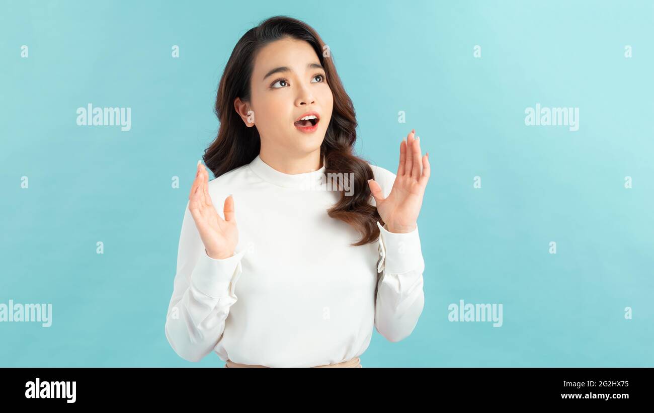 Emotive excited screaming asian girl yell about amazing shocking ...