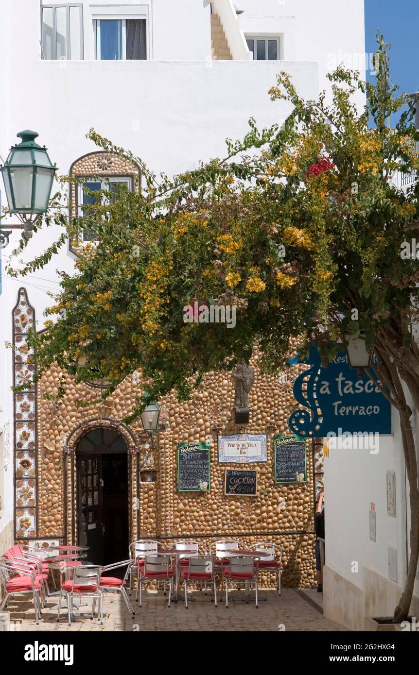 Albufeira, old town, café with shell facade, tables, small alley ...