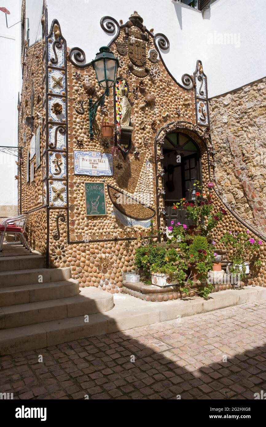 Albufeira, old town, café with shell facade Stock Photo - Alamy