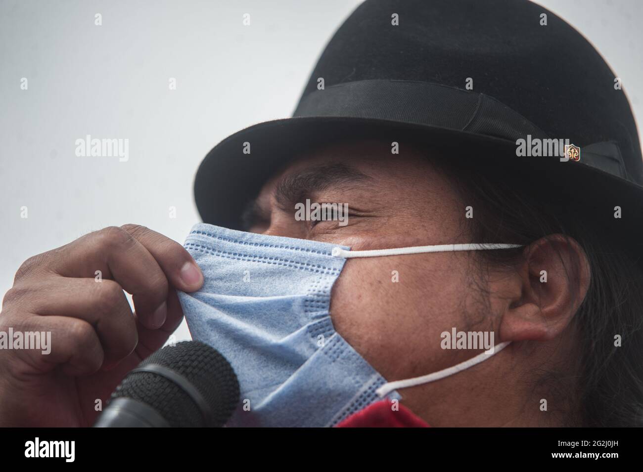 Latacunga, Ecuador. 11th June, 2021. Leónidas Iza adjusts his face mask ...