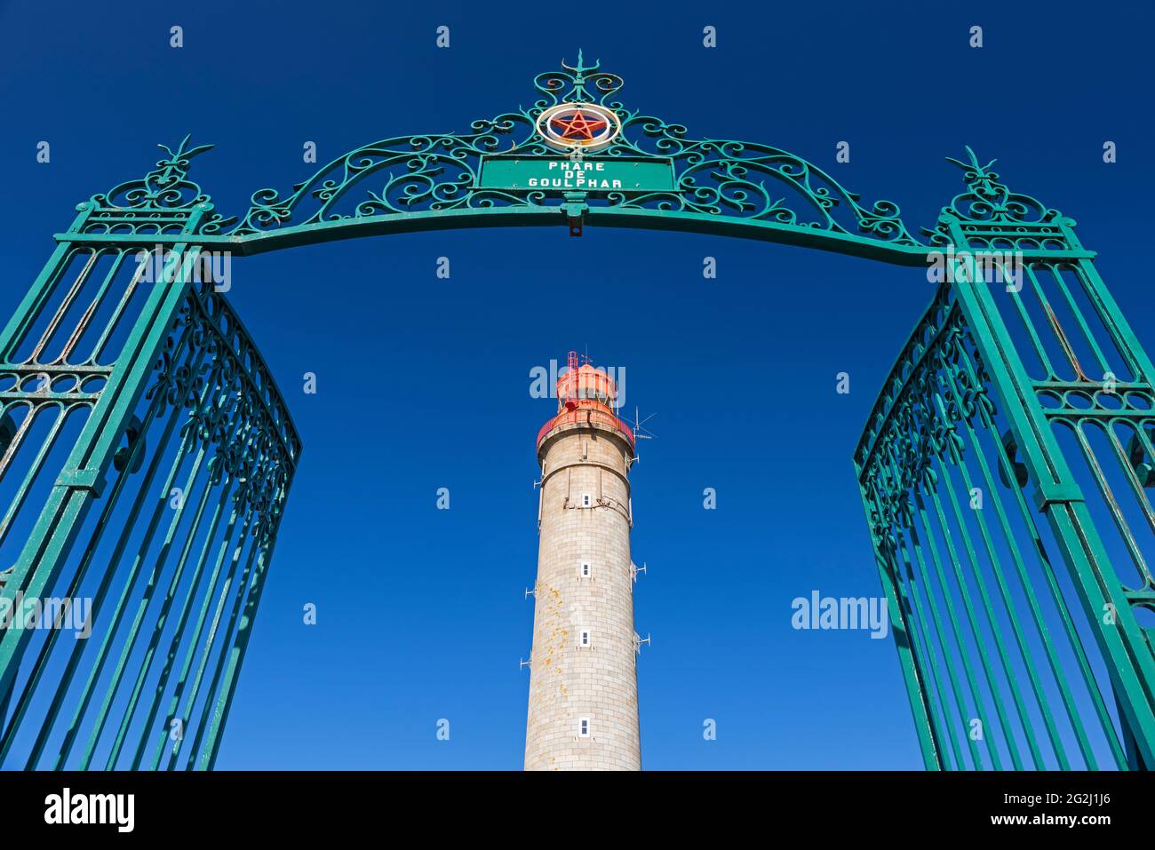 Goulphar lighthouse with ornate, wrought-iron entrance gate, Belle-Ile ...