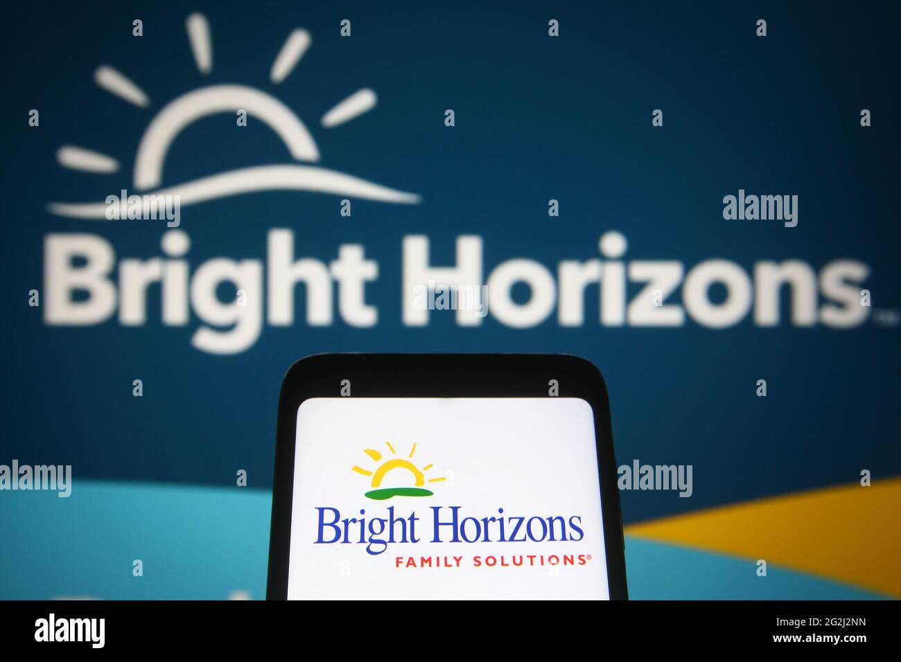 In this photo illustration a Bright Horizons logo is seen on a ...