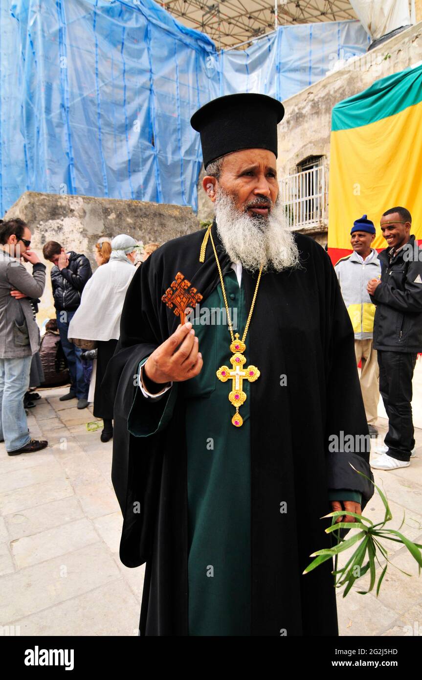 Ethiopian Orthodox priest at the Monastery of the Sultan on the rooftop ...