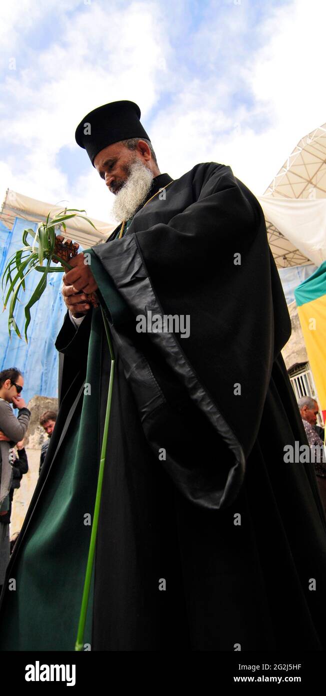 Ethiopian Orthodox priest at the Monastery of the Sultan on the rooftop ...