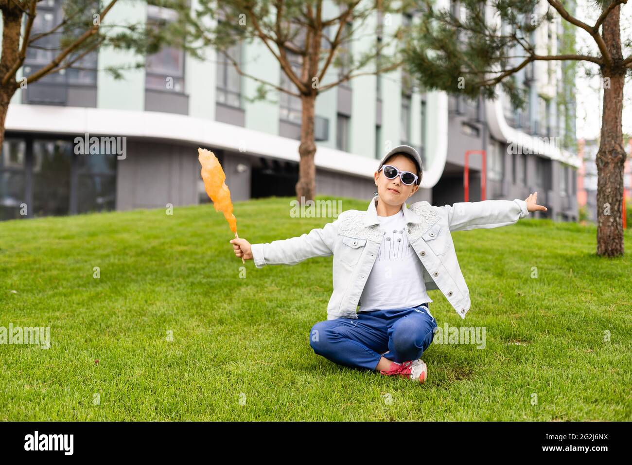 Beautiful girl at the park looking very happy Stock Photo - Alamy